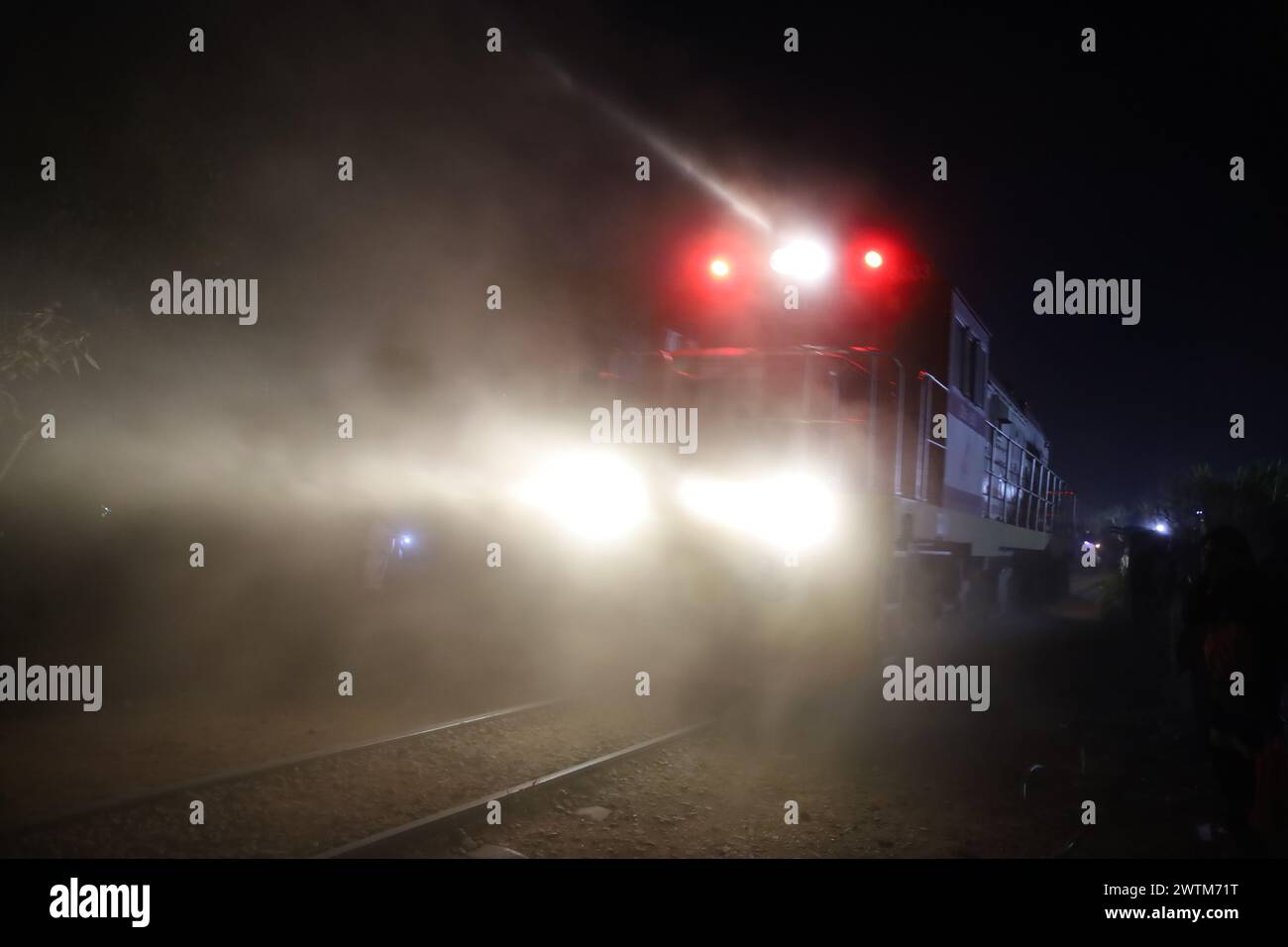 A commuter train passes through Kibera Railway Station. Kibera, the ...