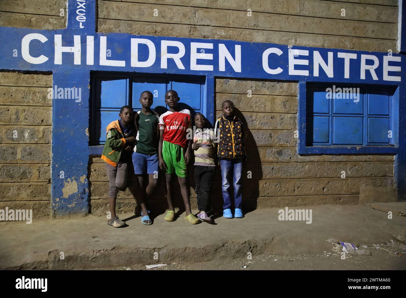 Young boys are posed ouside a children center in Kibera Slum, Nairobi ...