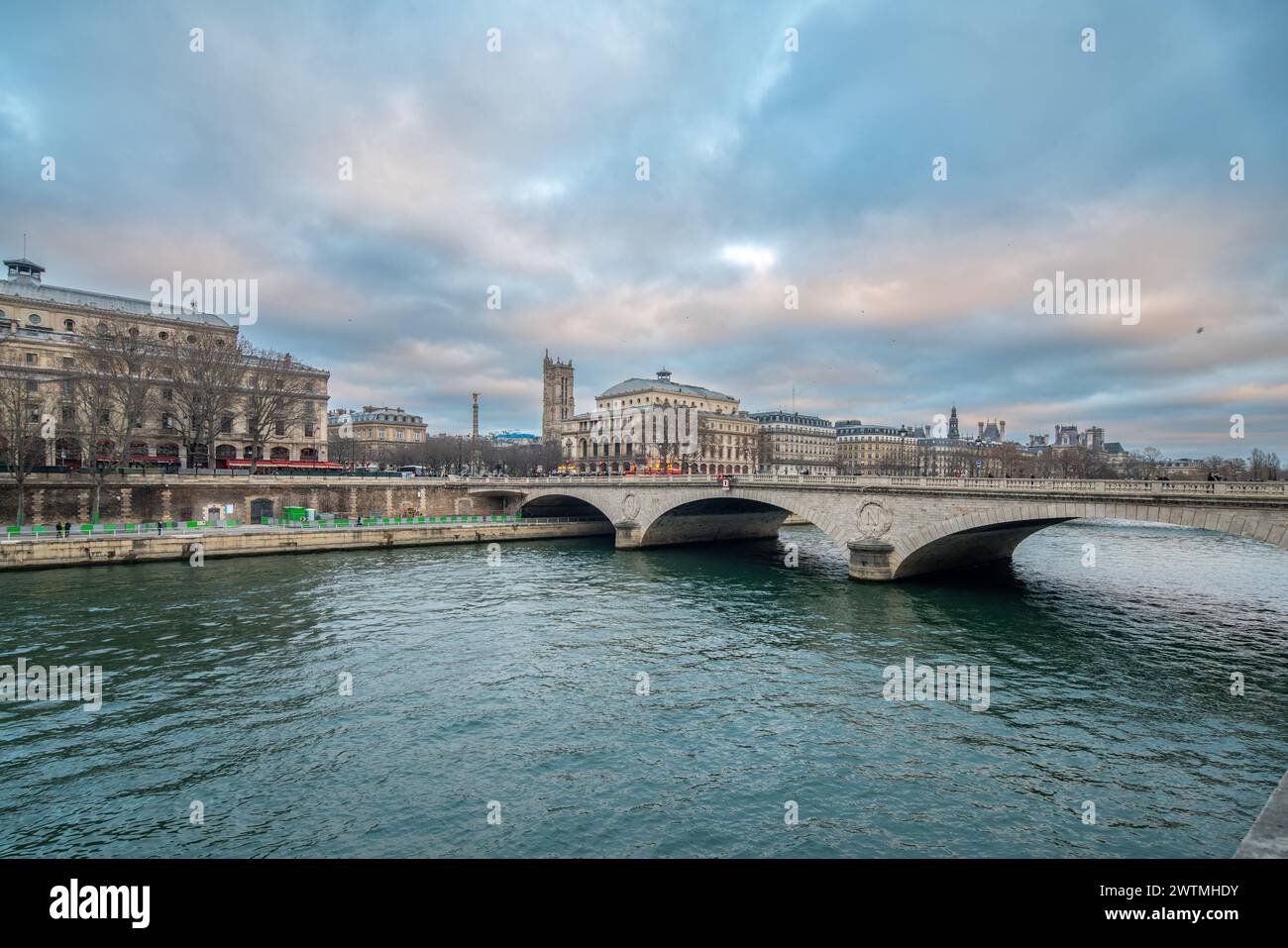 Au Change bridge crossing a body of water with buildings in the ...