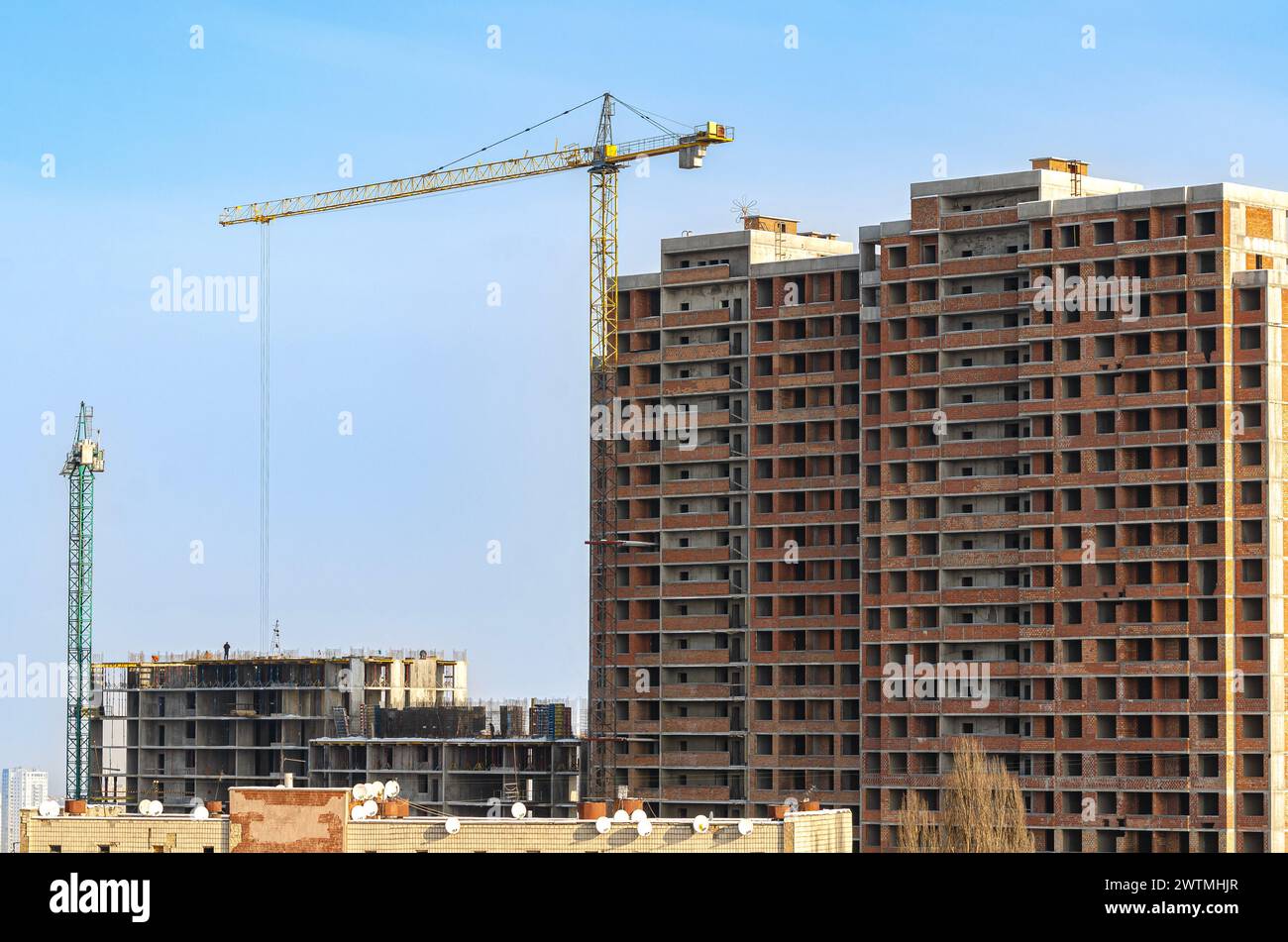 Cranes. Construction of a multi-storey residential building Stock Photo ...