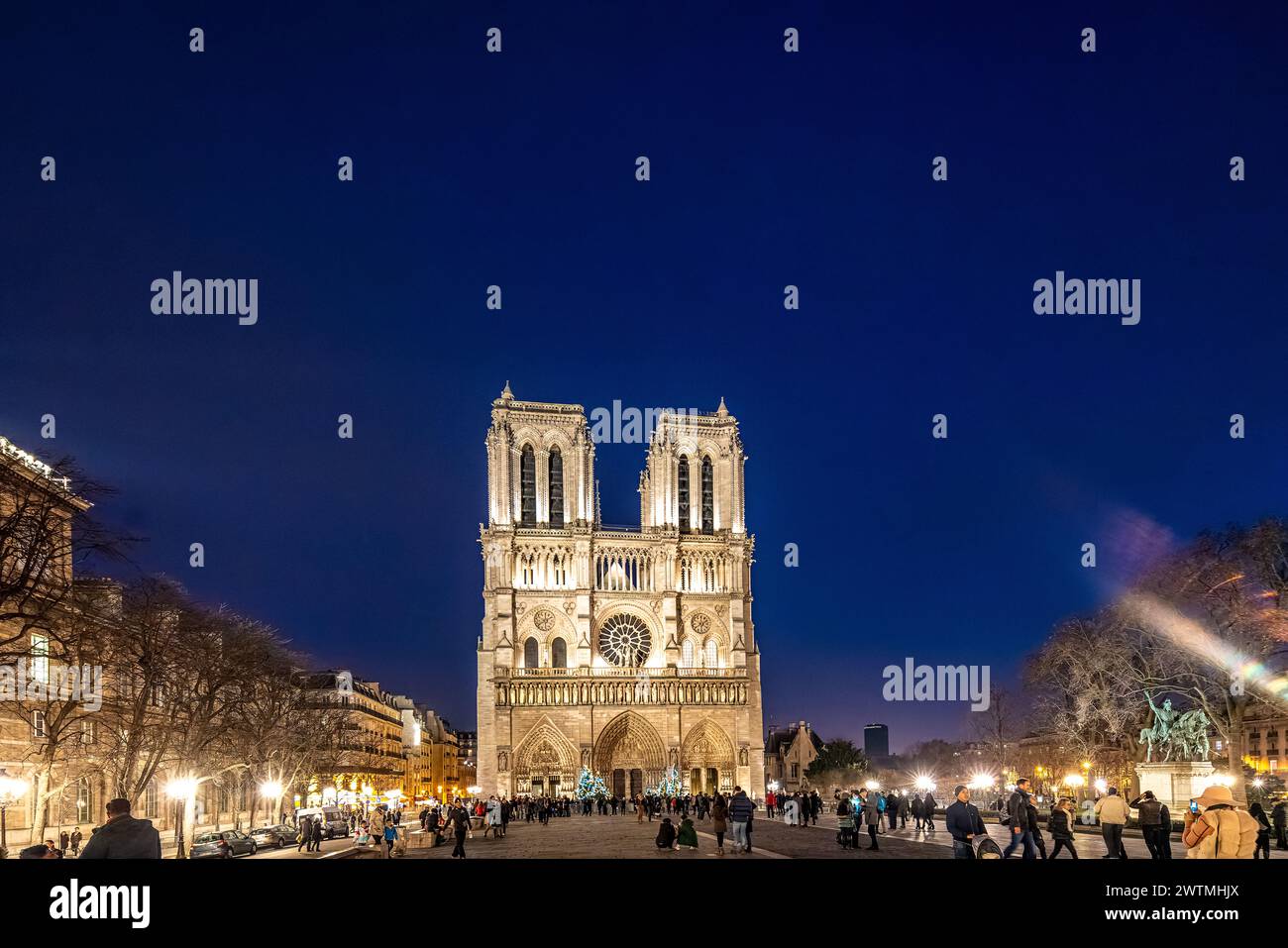 Crowd in front of iconic Notre Dame Cathedral during Christmas in Paris ...