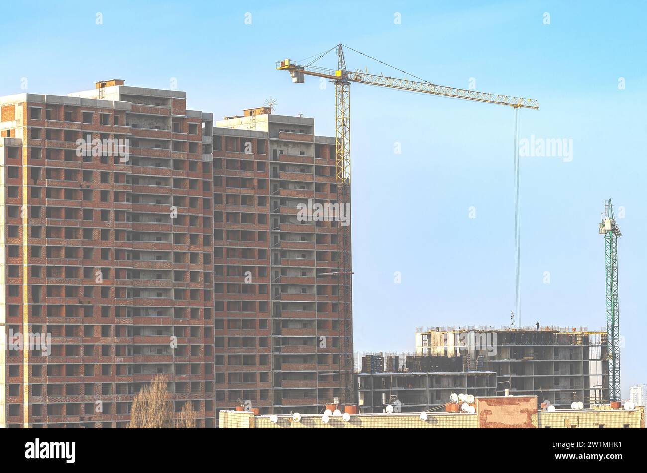 Cranes. Construction of a multi-storey residential building Stock Photo ...