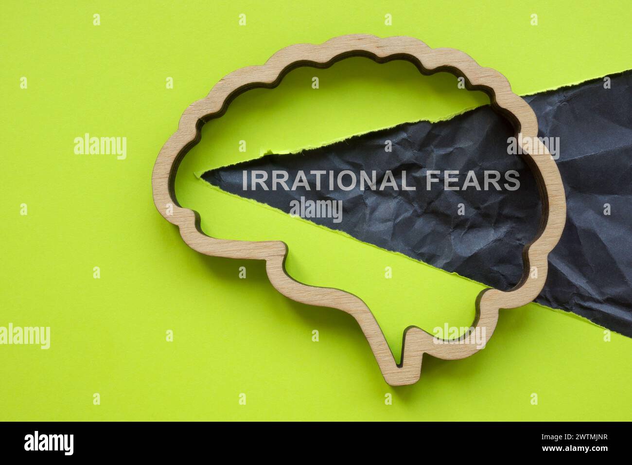 Irrational fears. Outline of the brain and a torn piece of paper Stock ...