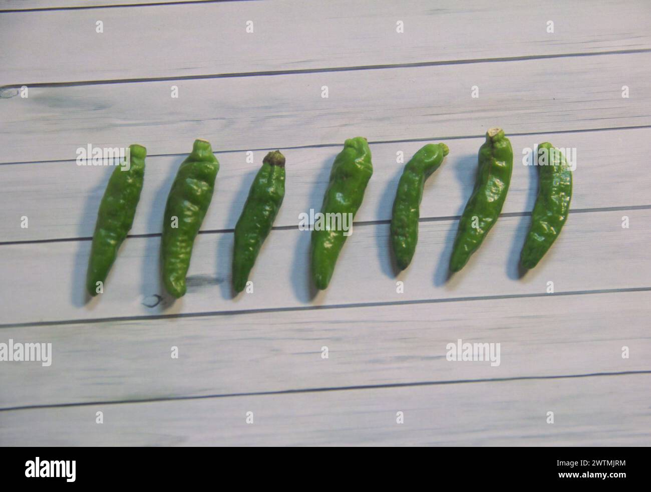 Cayenne pepper in the photo with a textured background Stock Photo - Alamy