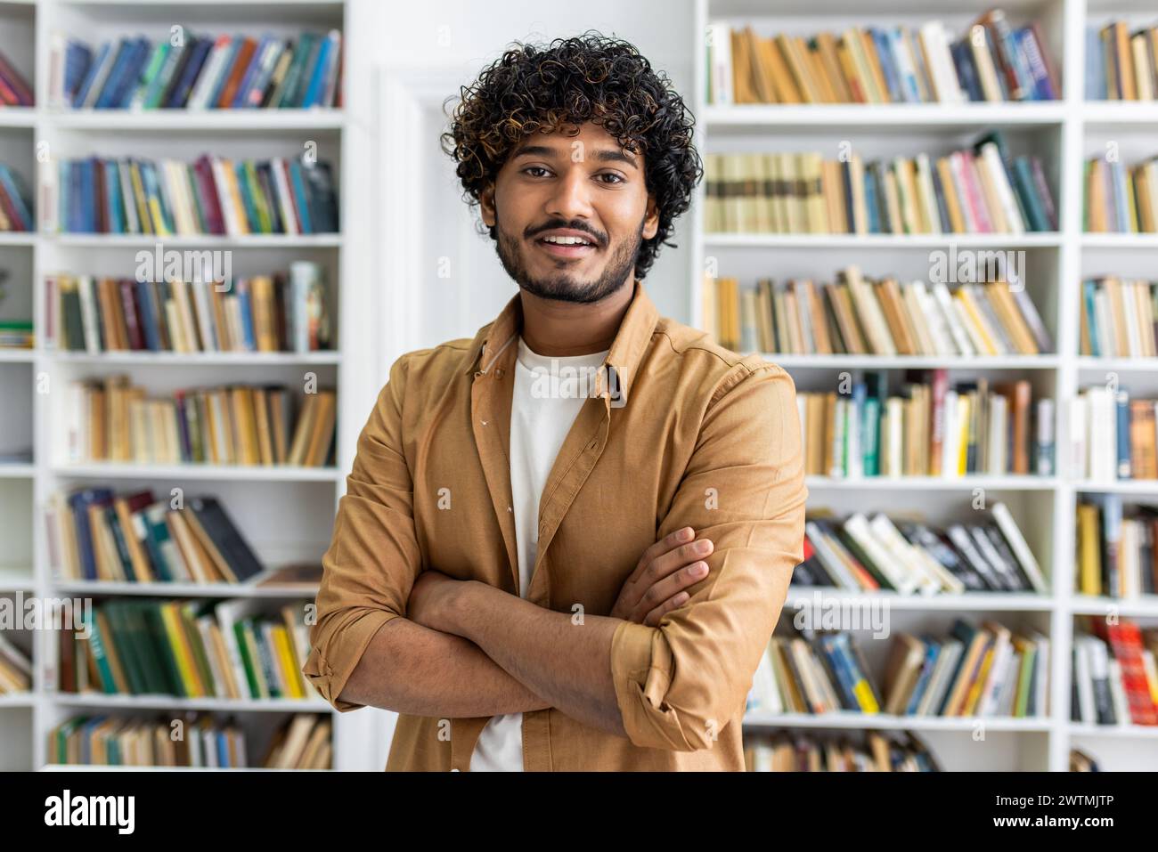 Confident diverse man in casual outfit looking at camera with arms ...