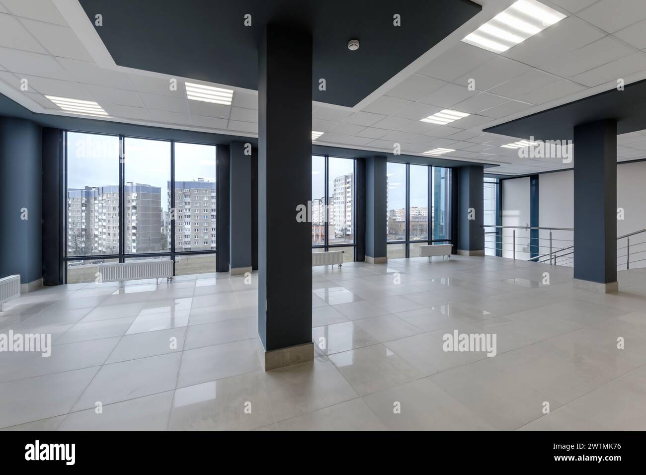panorama view in empty modern hall with columns, doors , stairs and ...