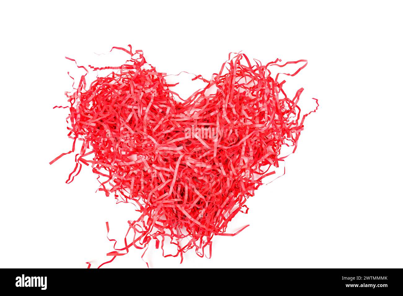 shredded paper in the shape of a heart on a white background. A heart ...