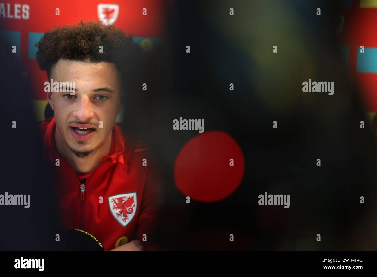 Cardiff, UK. 18th Mar, 2024. Ethan Ampadu of Wales speaks to the media ...