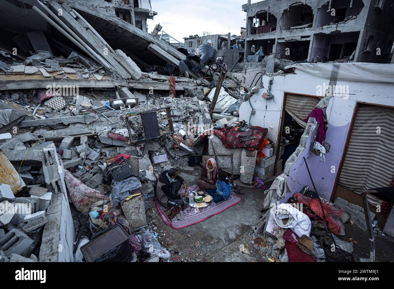 Members of the Al-Rabaya family break their fast during the Muslim holy ...