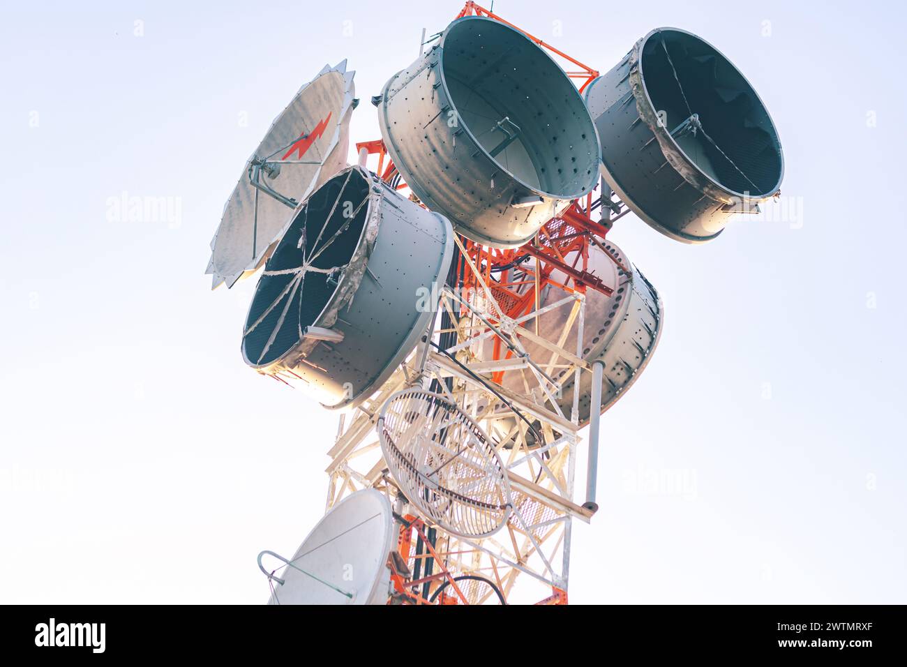 Old Telecommunication tower with dish antennas. Global connection and ...