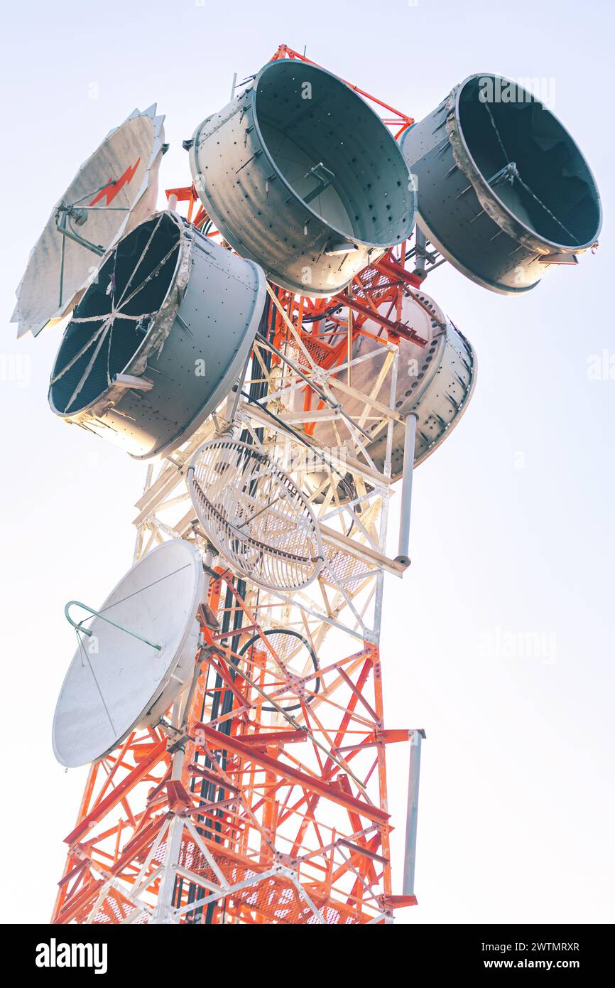 Old Telecommunication tower with dish antennas. Global connection and ...