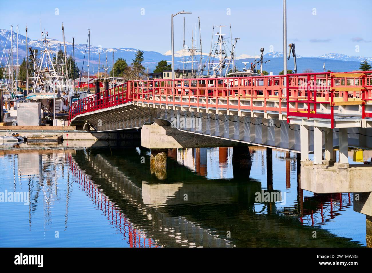 A side view showing the underside and reflections in the ocean of a ...