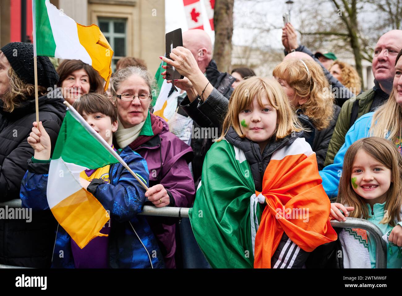 London, England, UK. 17th Mar, 2024. Crowds wait for the parade as ...