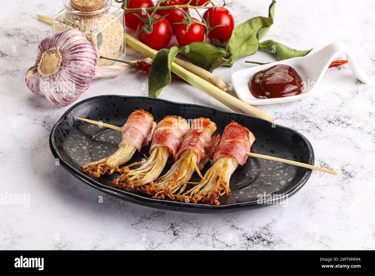 Tasty Grilled enoki mushroom with bacon Stock Photo - Alamy