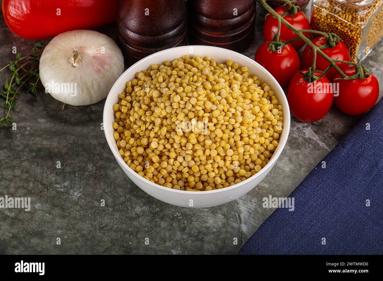 Dry ptitim heap in the bowl for cooking Stock Photo - Alamy