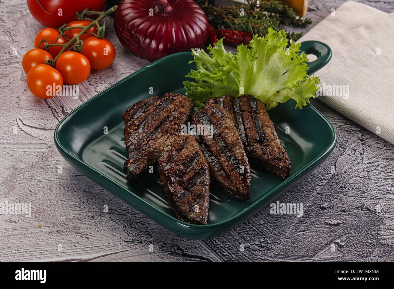 Grilled diet beef liver steak in the plate Stock Photo - Alamy
