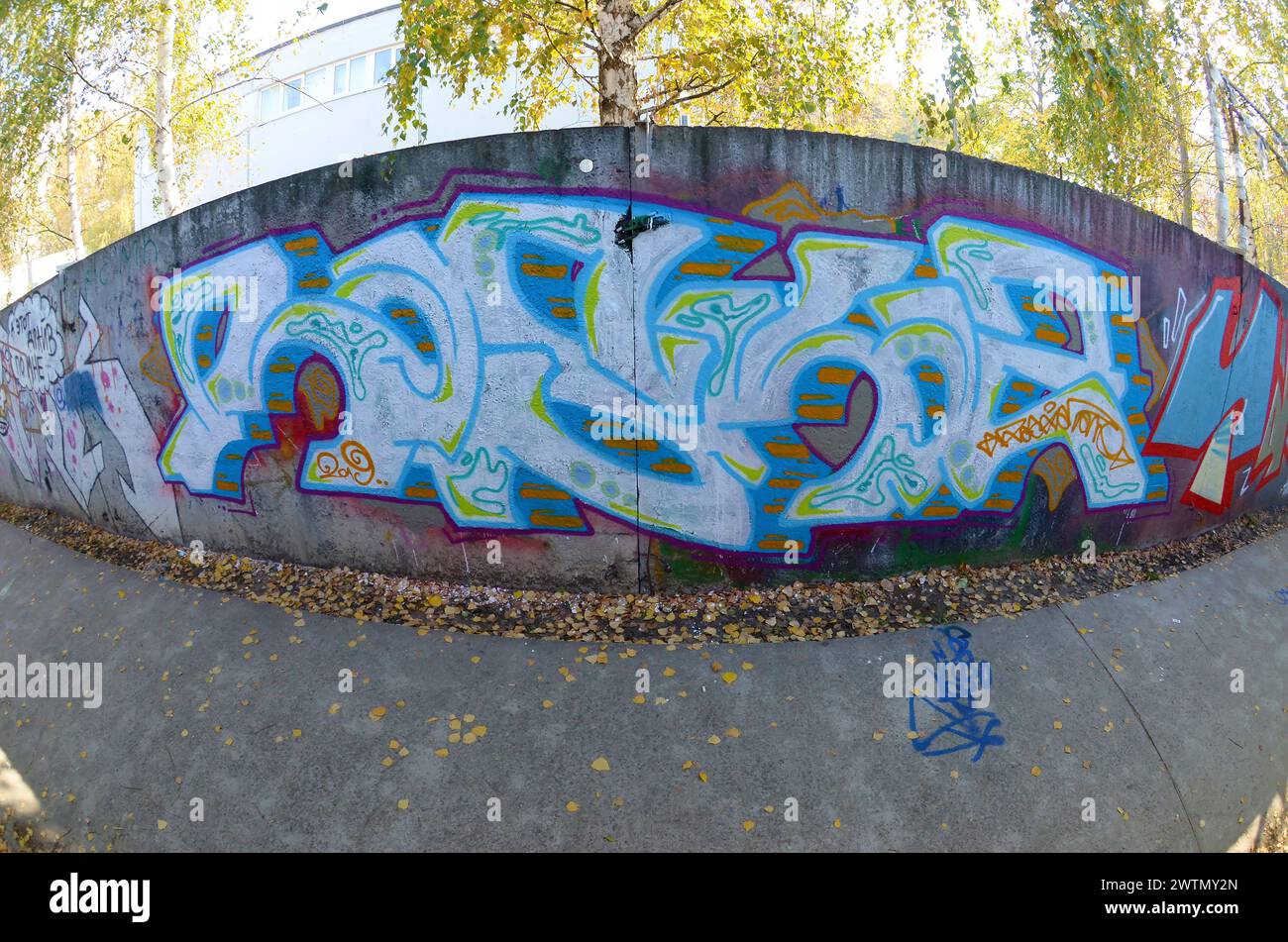 Fisheye shot of street art graffiti drawing on wall. Spray art artwork ...