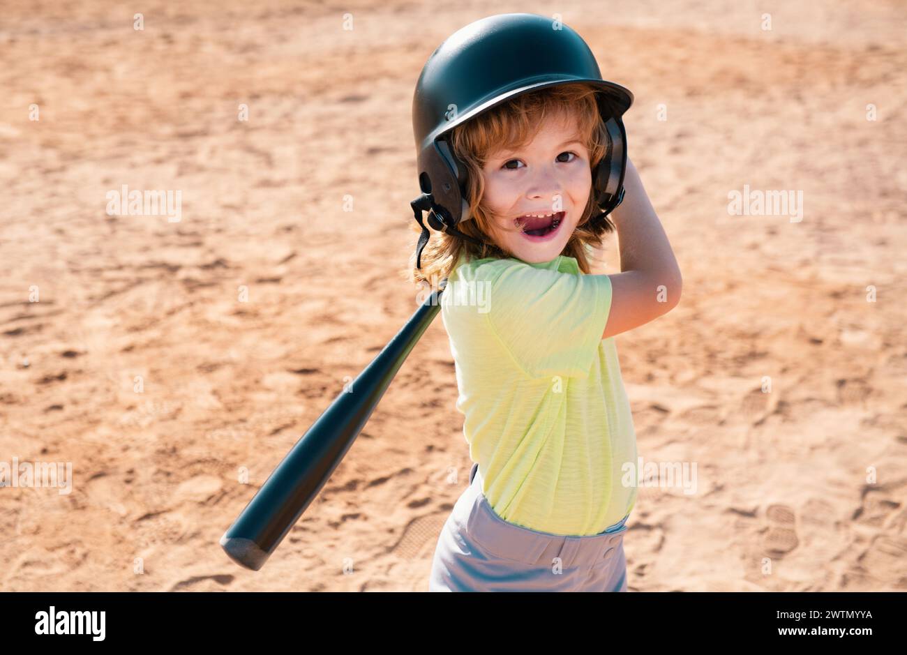 Kid holding a baseball bat. Pitcher child about to throw in youth ...