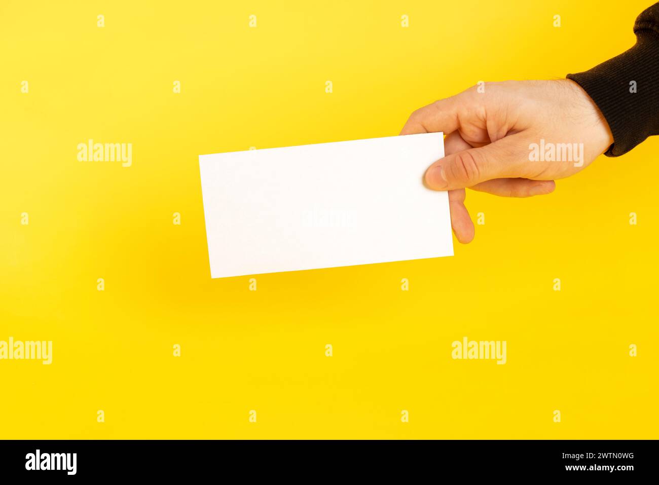 Hands with business card. Hand holding a white card on a coloured ...