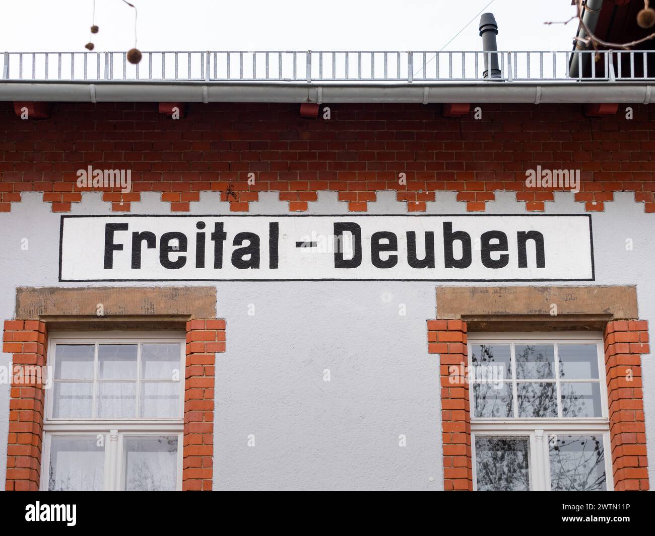 Freital-Deuben sign on a building facade of the train station. Close up ...