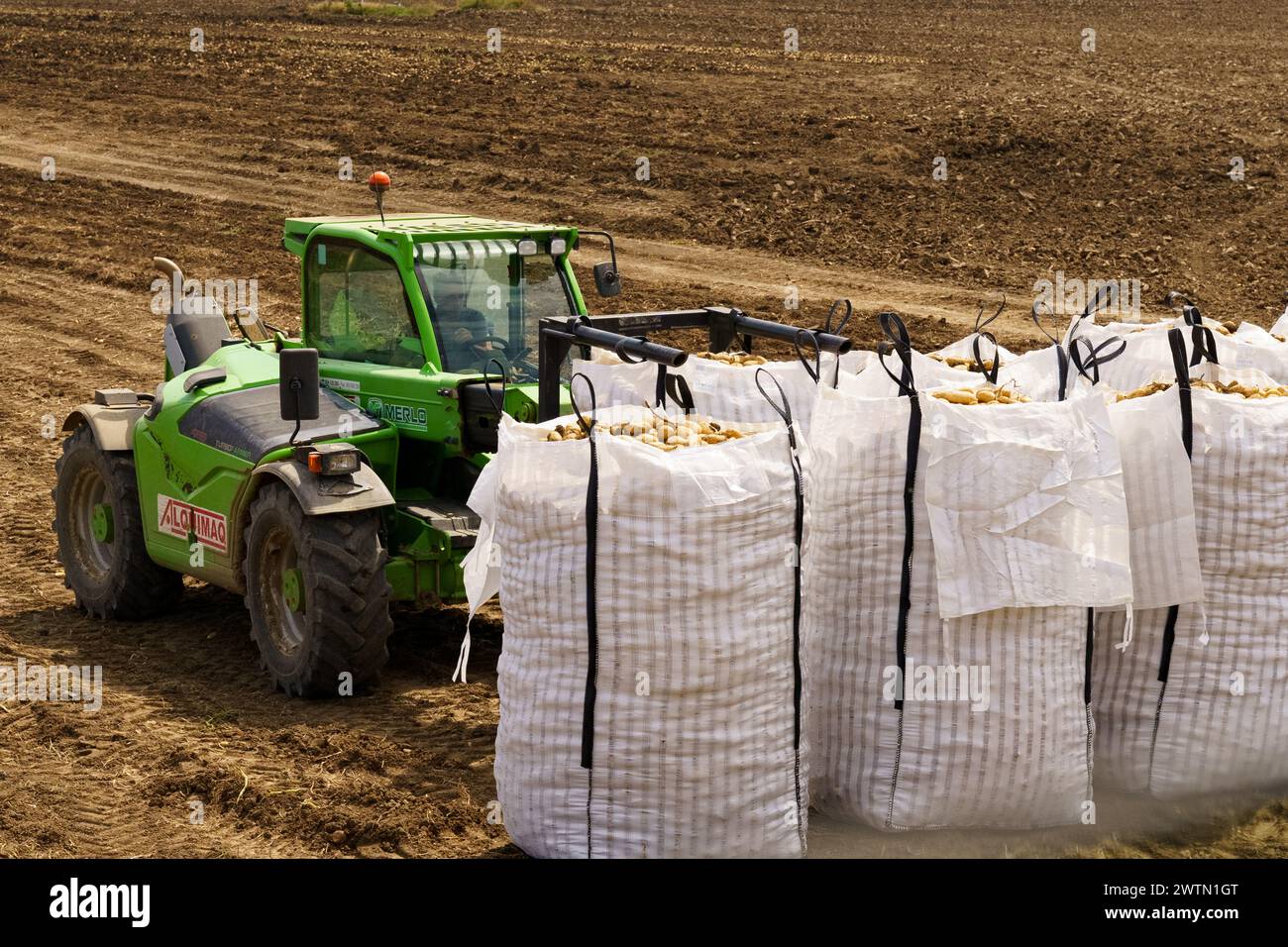 Huevar del Aljarafe, Seville, Spain - June 2, 2023: A tractor pulls a ...