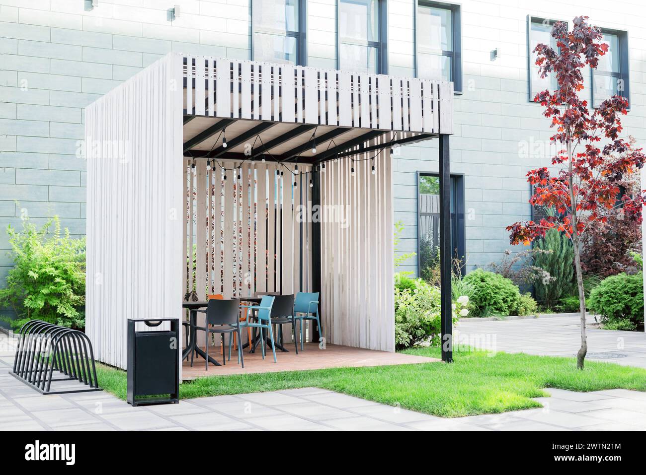 Modern smoking zone outside. business building, wooden gazebo with ...