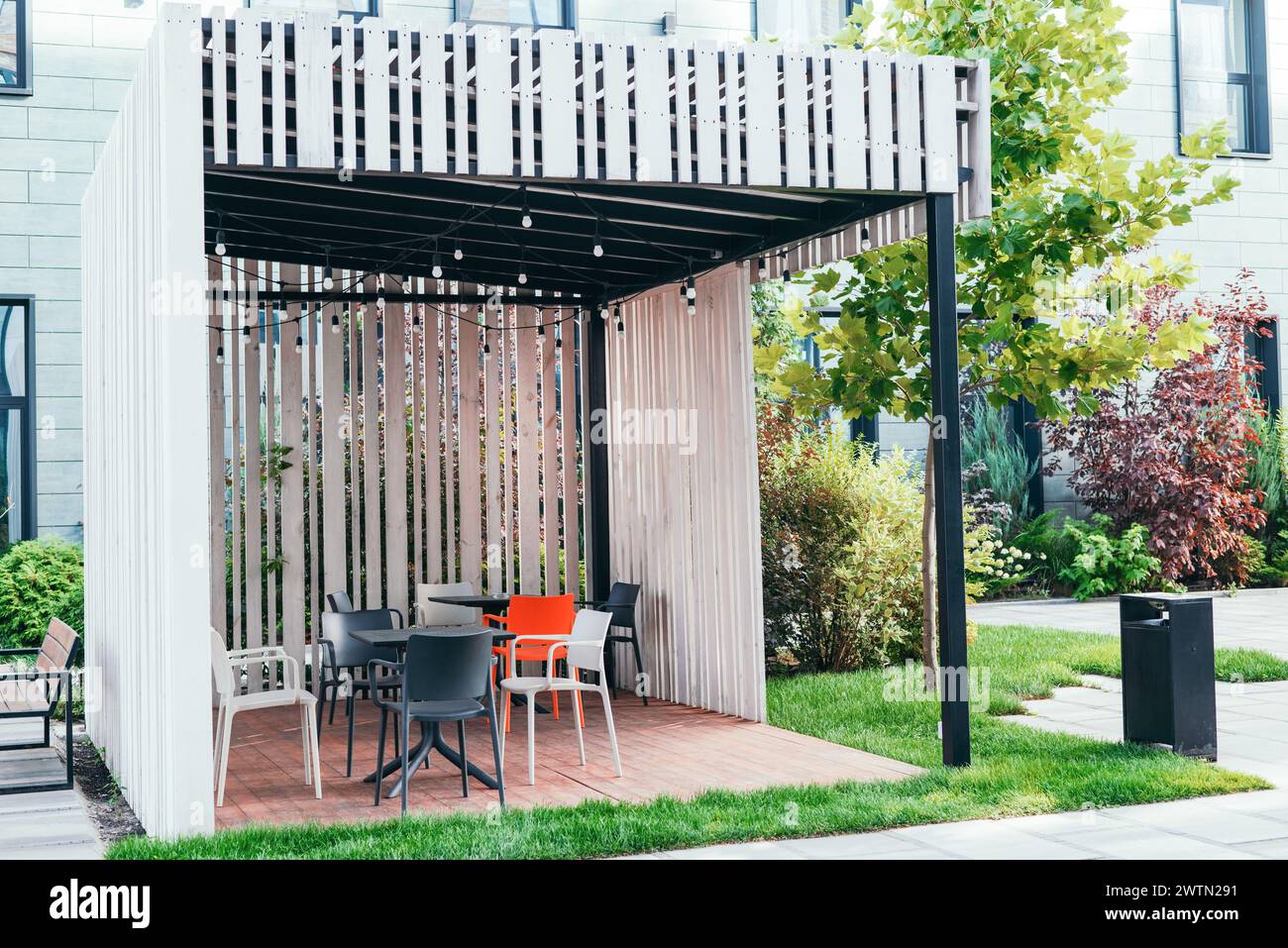 Modern smoking zone outside. business building, wooden gazebo with ...
