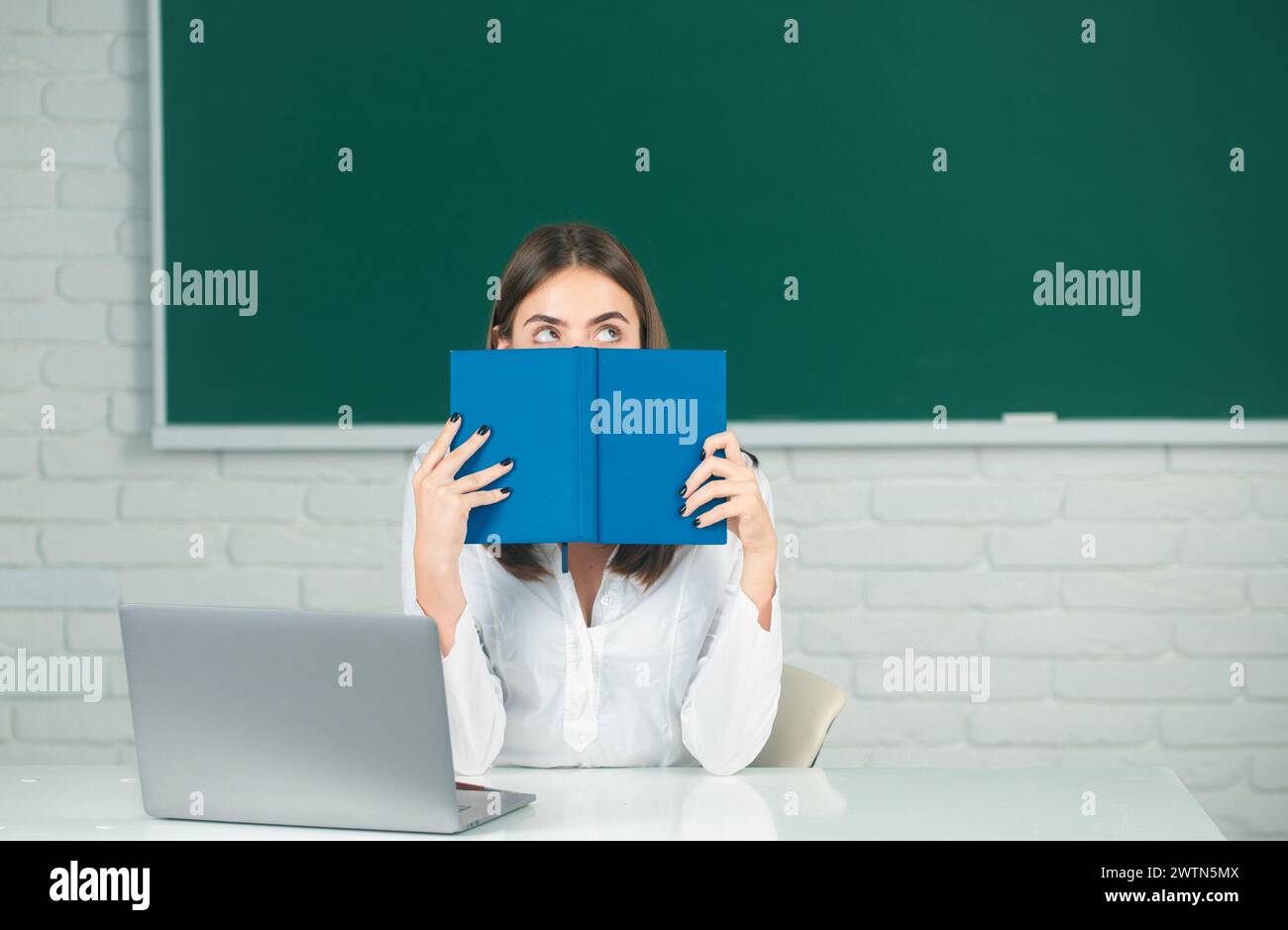 Portrait of a young, confident and attractive female student studying ...