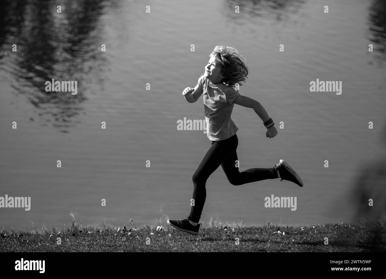 Child boy runners run in park. Outdoor sports and fitness for children ...