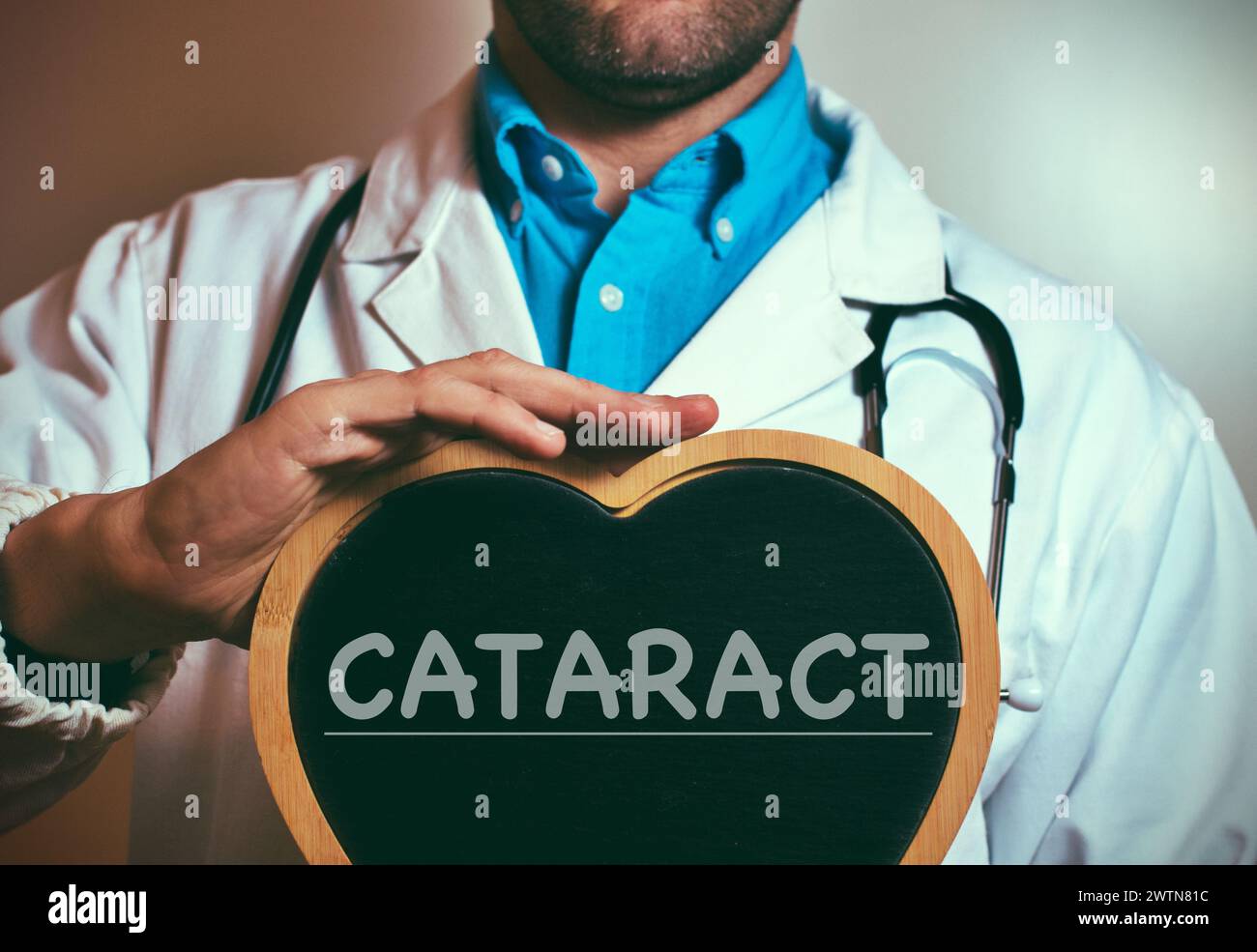 Eye Doctor using a blackboard showing the word: CATARACT. Healh care ...