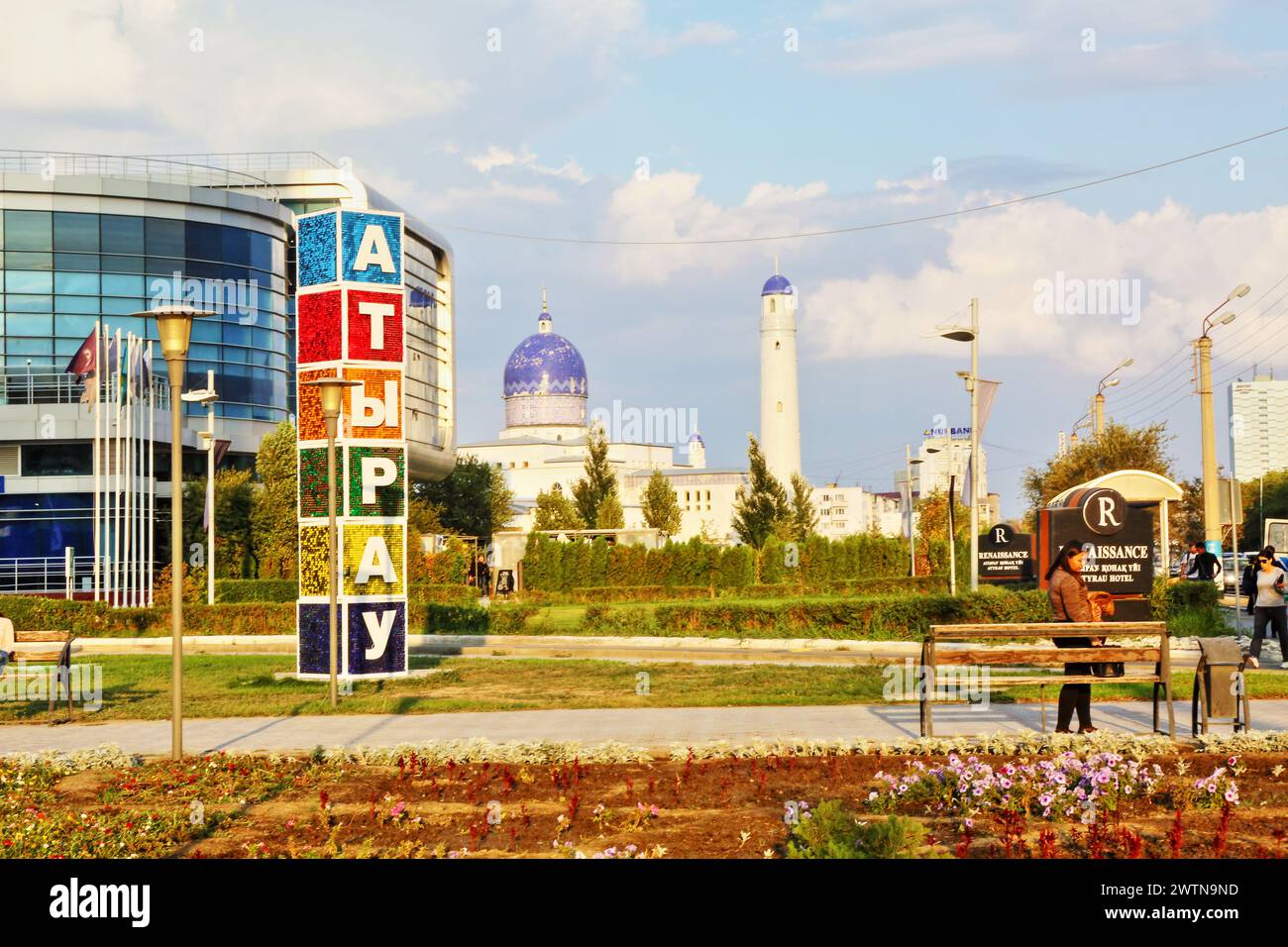The view of an old mosque and modern buildings in Atyrau, the biggest ...