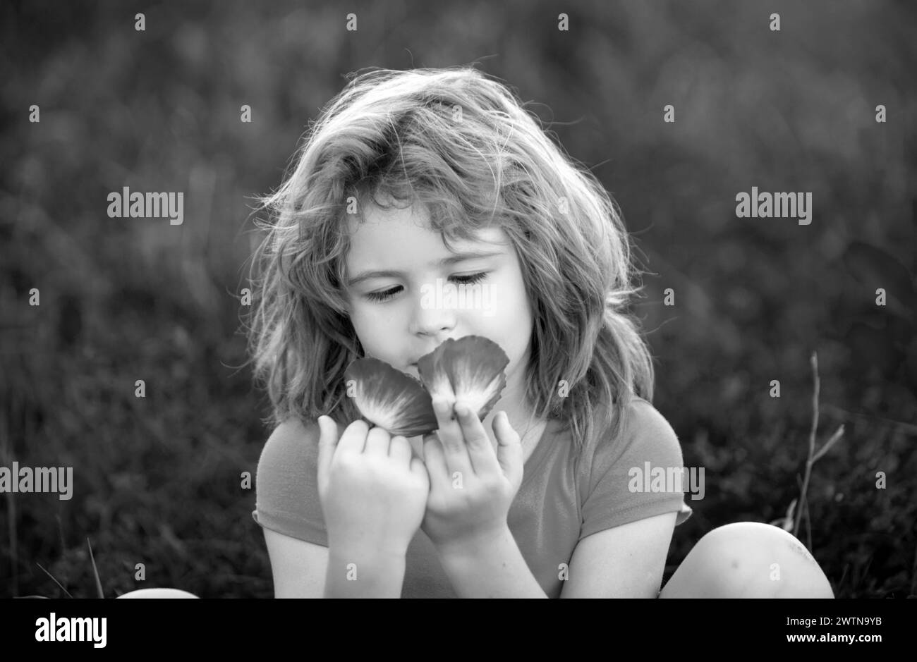 Child smelling Black and White Stock Photos & Images - Alamy