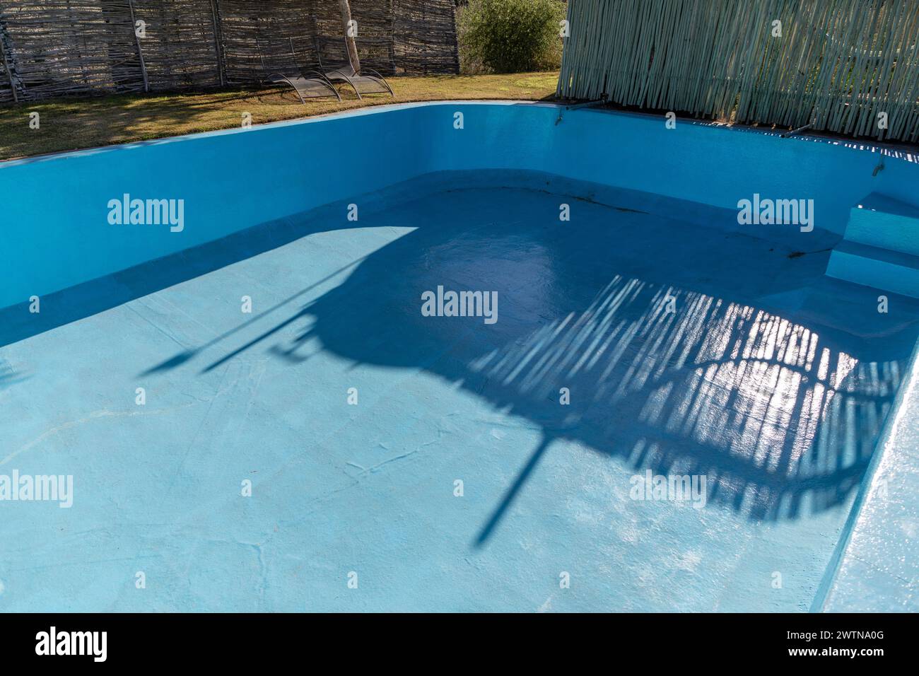 Portion of a fibreglass lined empty resort swimming pool. Concept for ...