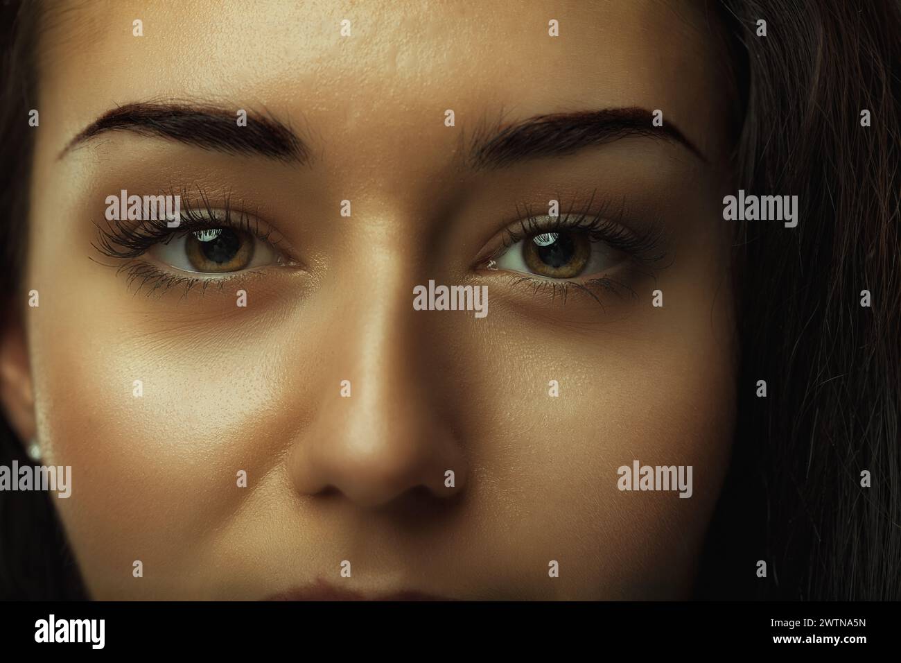 Depth and emotion resonate within her captivating stare Stock Photo - Alamy