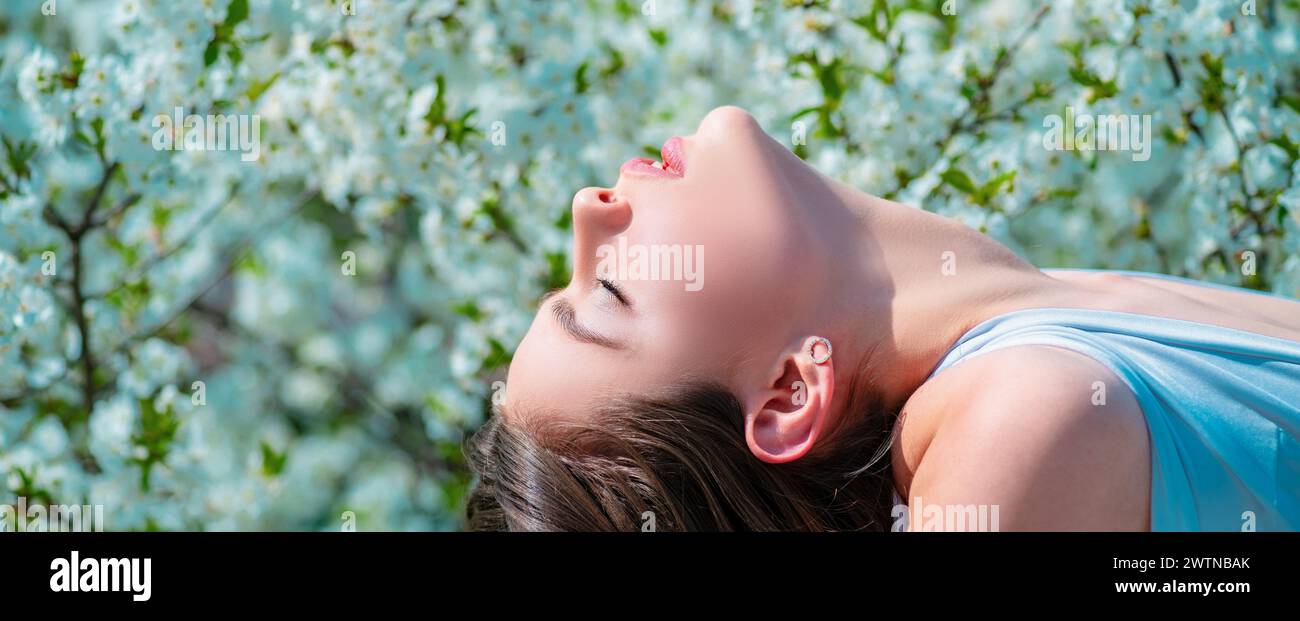 Spring female face concept. Beautiful girl on green spring garden ...