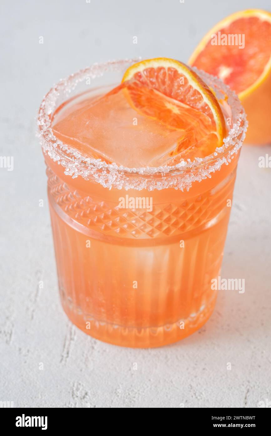 Blood Orange Margarita cocktail garnished with orange wheel Stock Photo ...