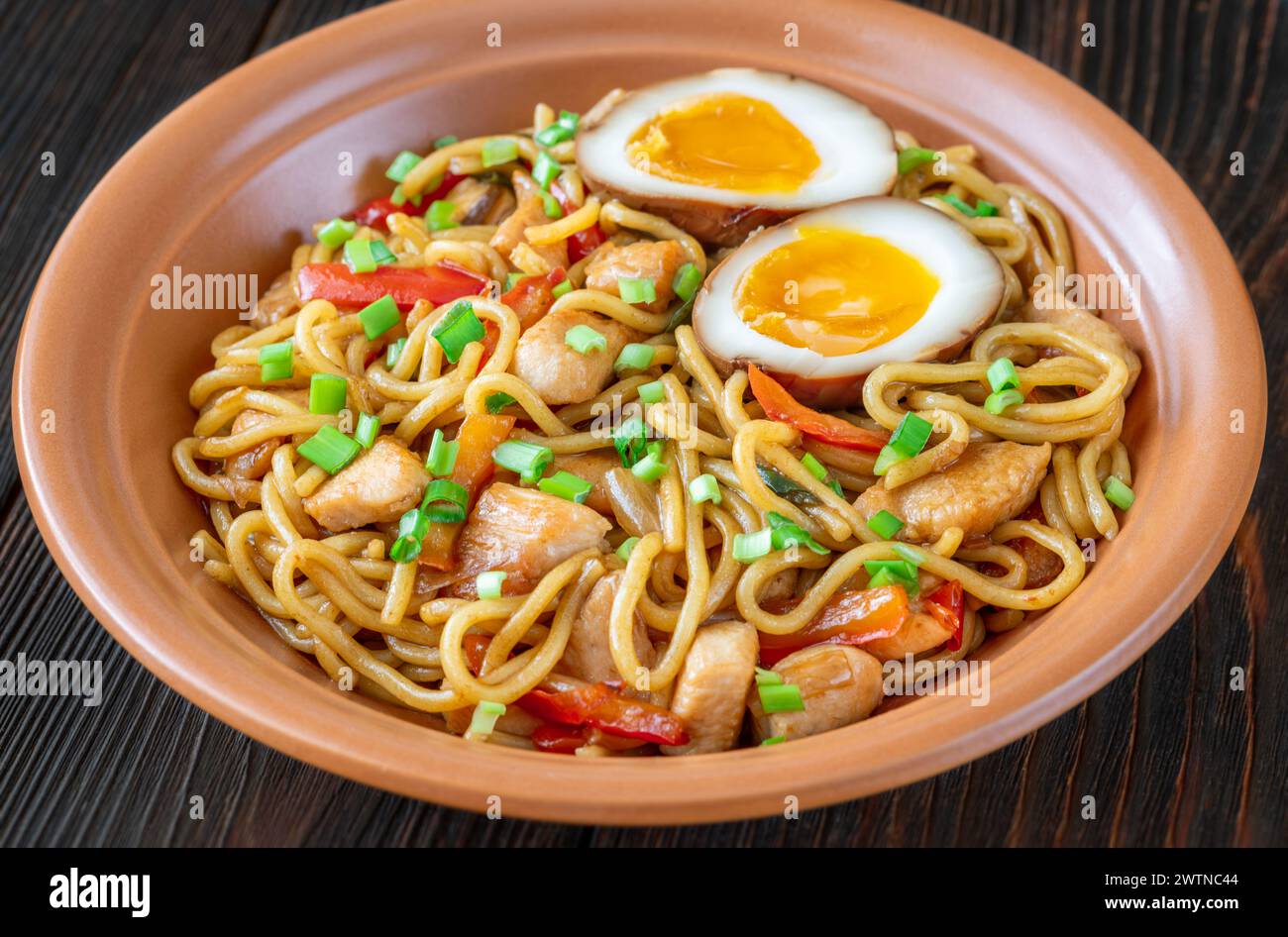 Bowl of Chicken Ramen Noodles garnished with spring onion Stock Photo ...