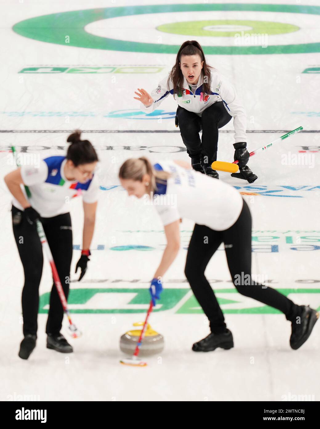 Italy skip Stefania Constantini, top right, directs the line of her ...