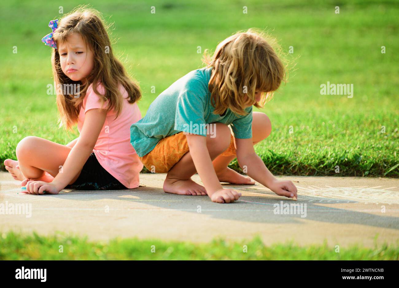 Kids relationships and adaptation. Couple of children playing outdoor ...