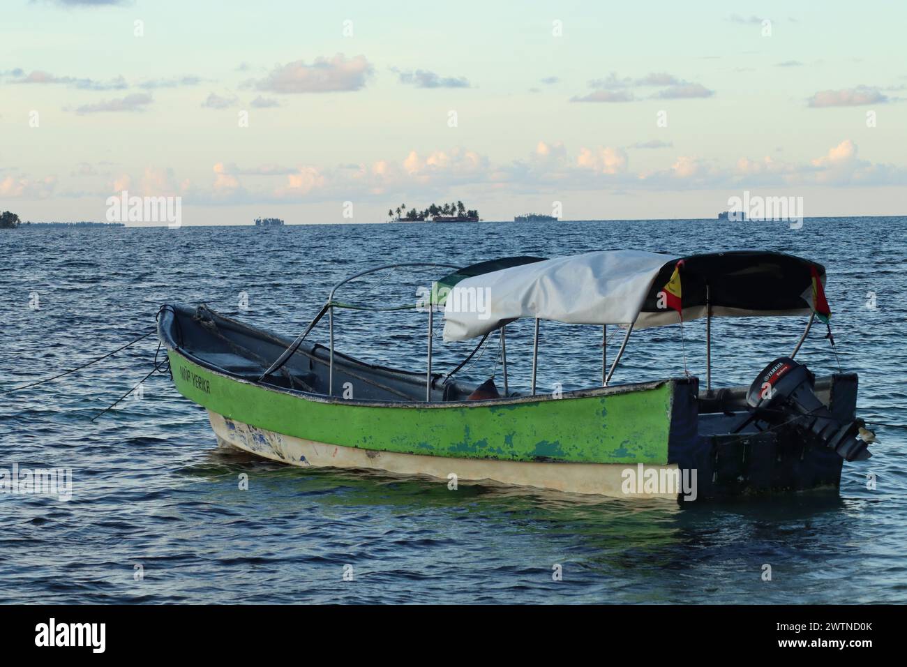 Boat on a tropical sea Stock Photo - Alamy