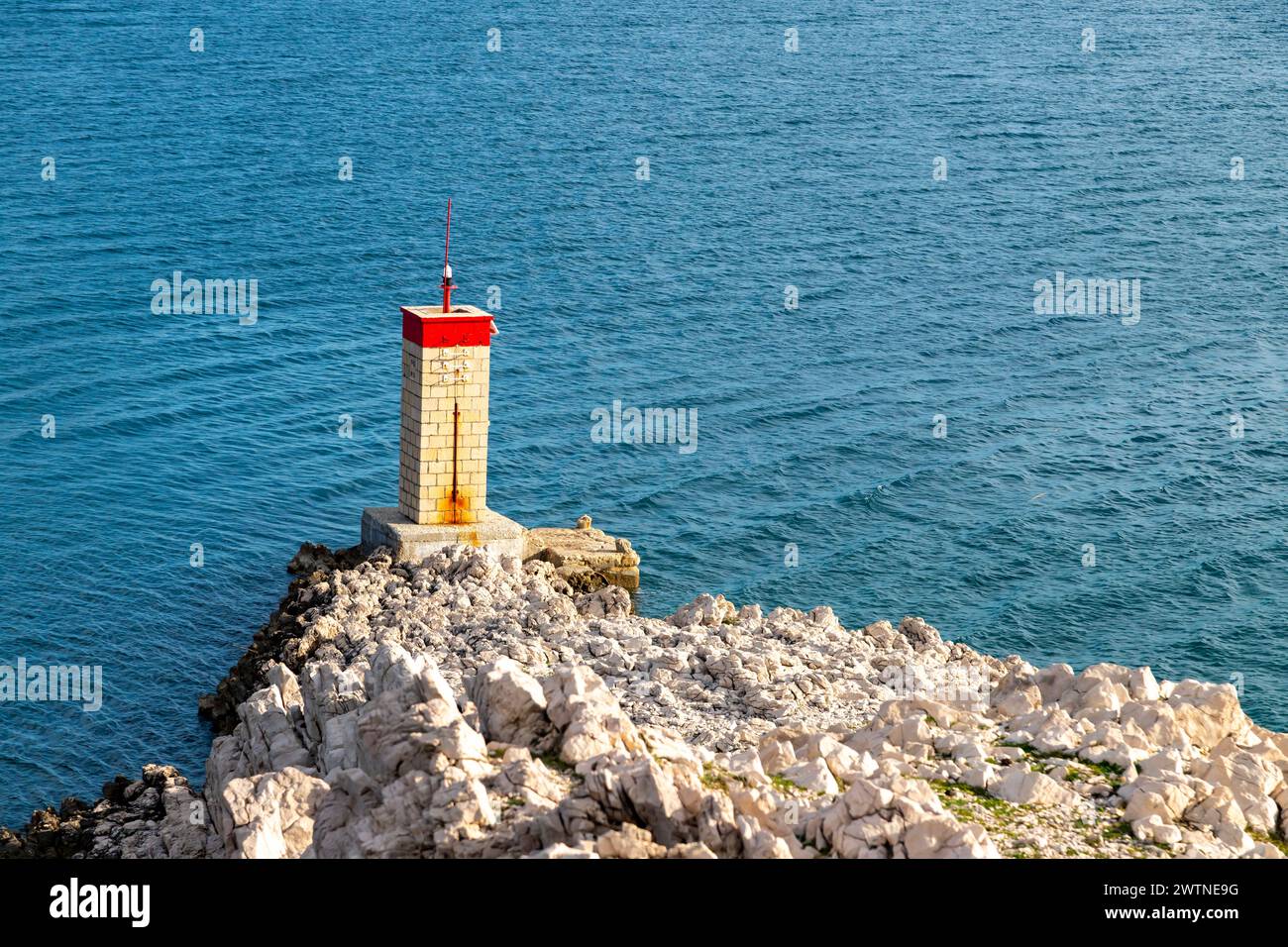 the lighthouse marks the passage through the strait Stock Photo - Alamy