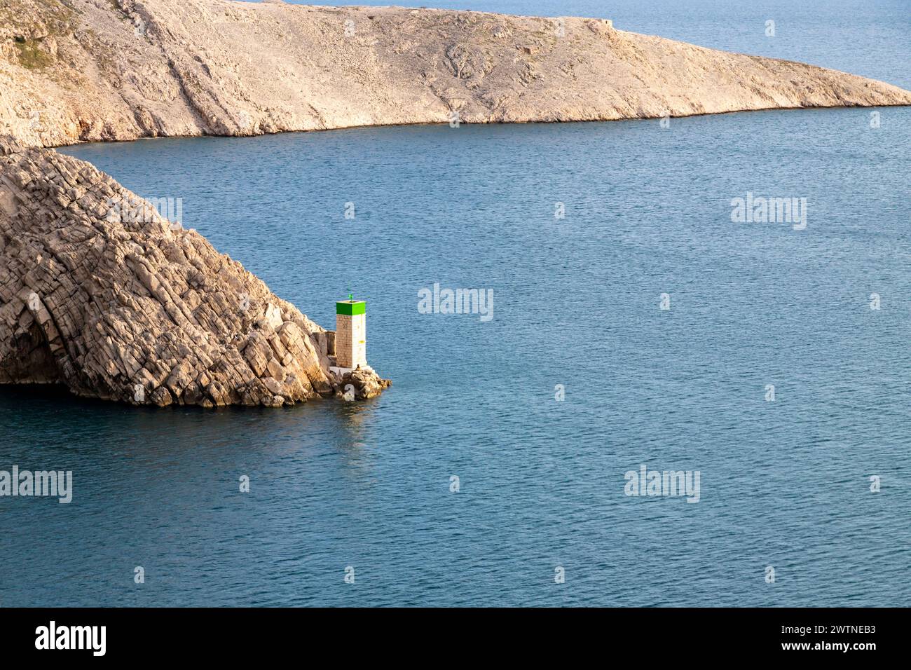 the lighthouse marks the passage through the strait Stock Photo - Alamy