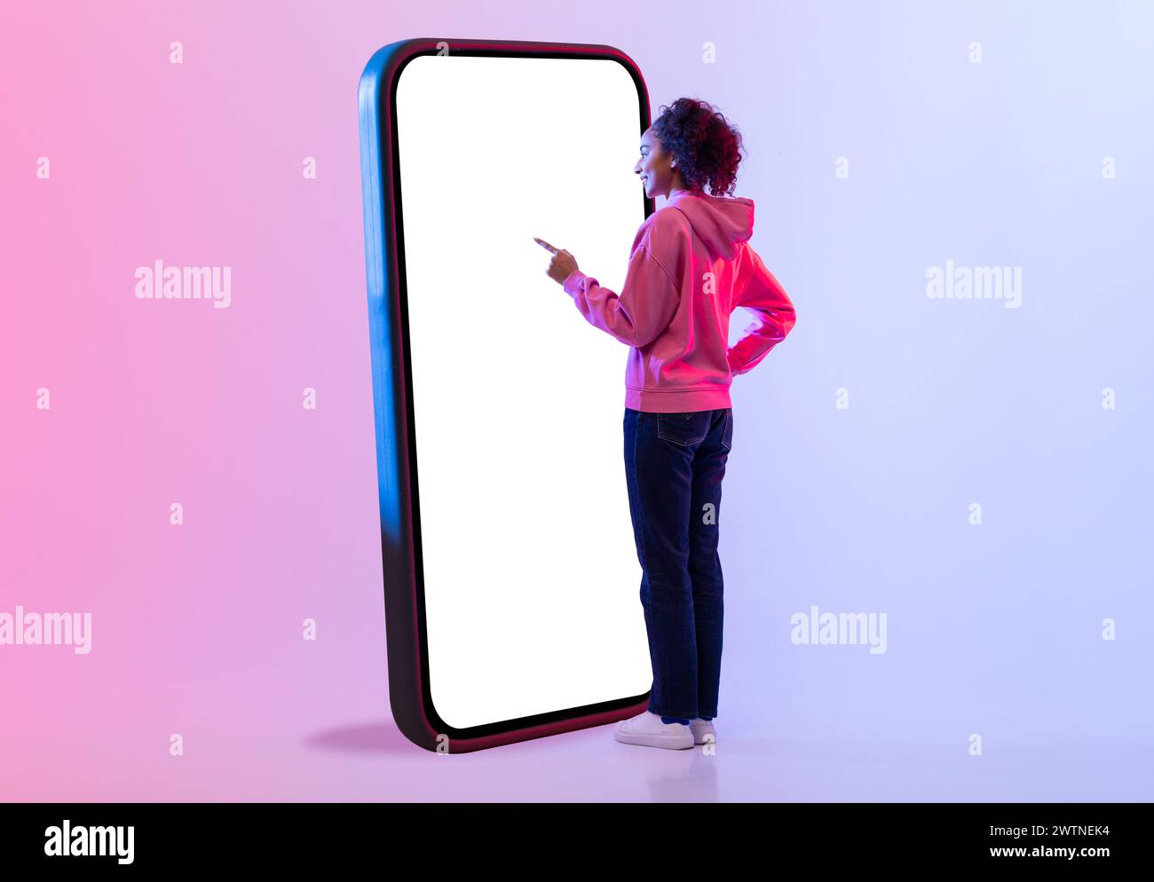 Woman interacts with giant smartphone in studio, mockup Stock Photo - Alamy