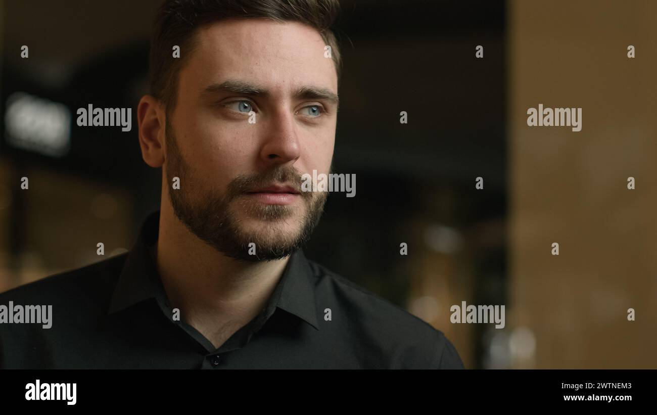 Dreamy Caucasian man stand indoors male portrait pensive inspired male ...