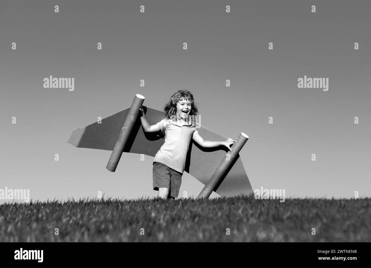 Dreams of travel. Child flying on jetpack with toy airplane on sky ...