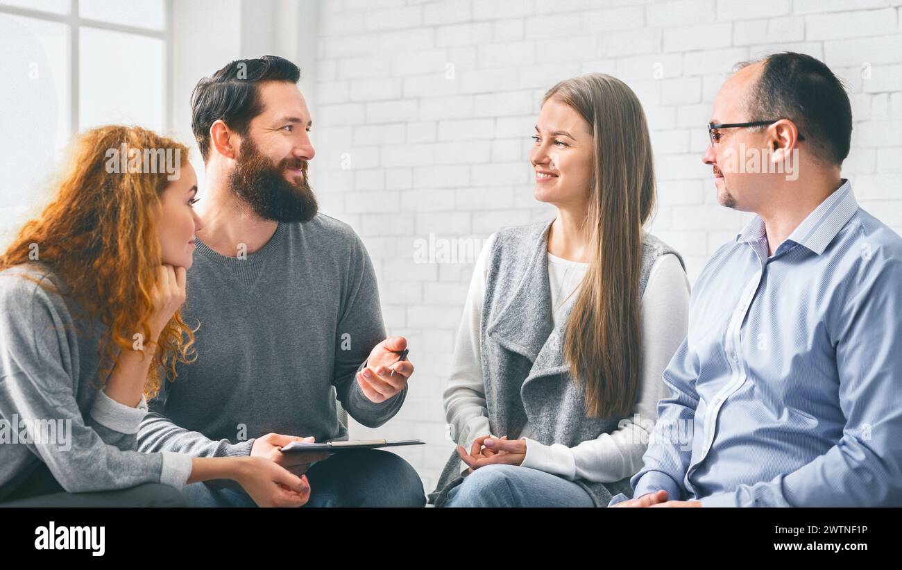 Therapist talking with patients during support group session Stock ...