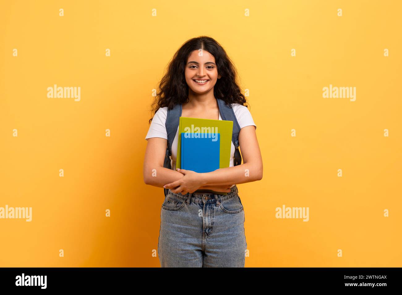 Smart student with blue notebooks Stock Photo - Alamy