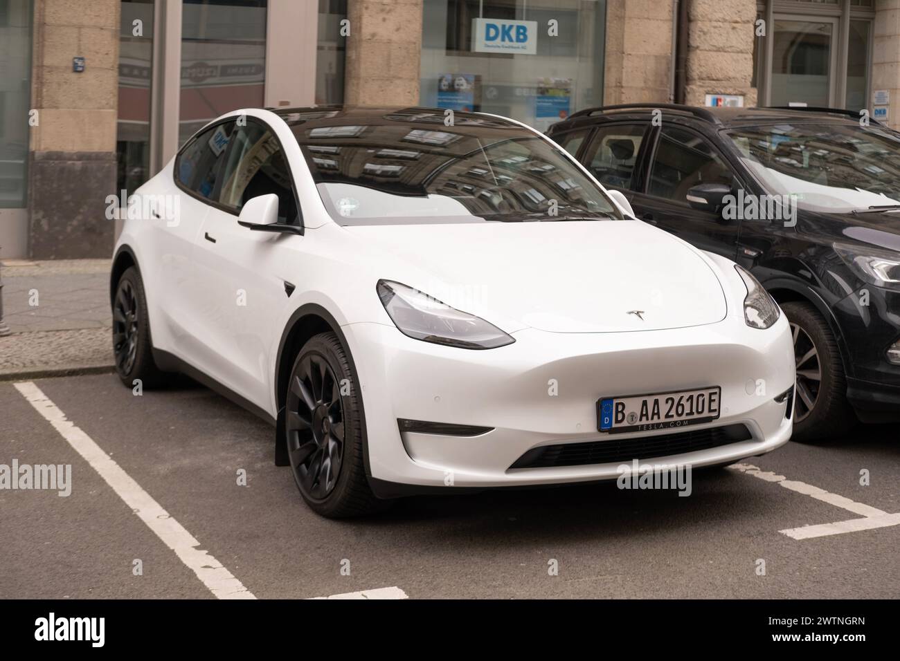 white Model y car on street of Berlin, eco-friendly vehicle in urban ...