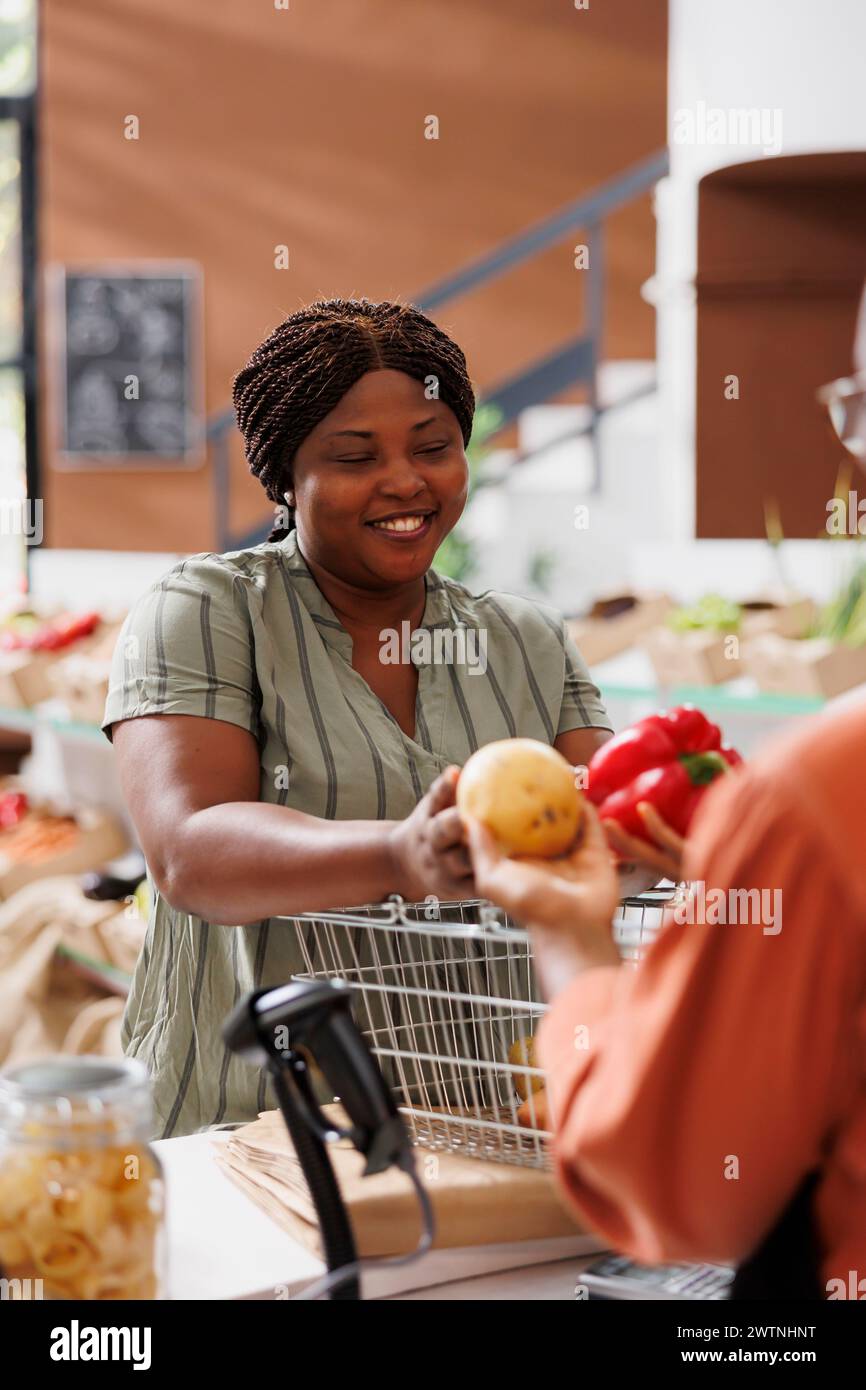 Happy young black female shopkeeper hi-res stock photography and images ...
