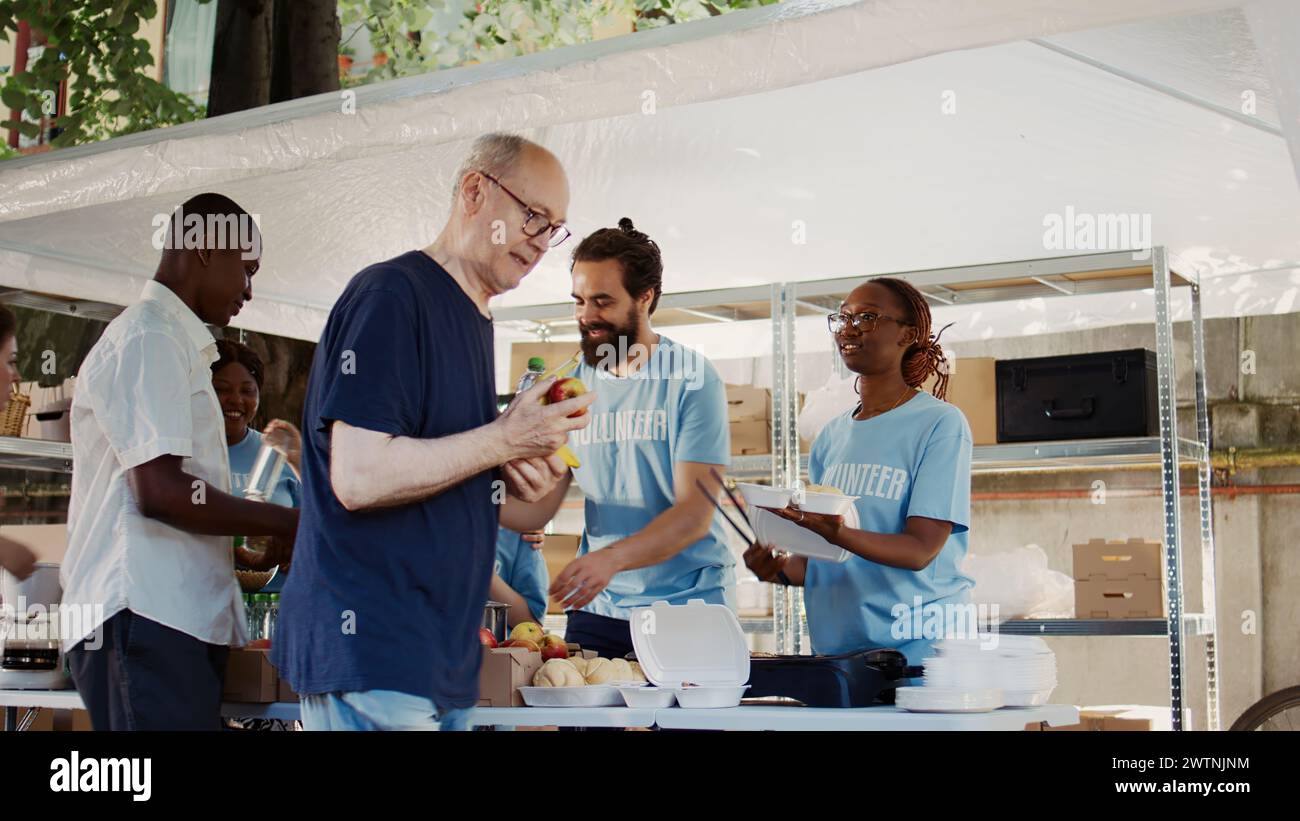 In this shot we see the poor and homeless people receiving free food ...